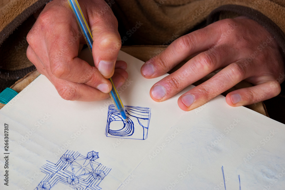 Man hands drawing sketch with pen. Abstract art work. Stock Photo ...