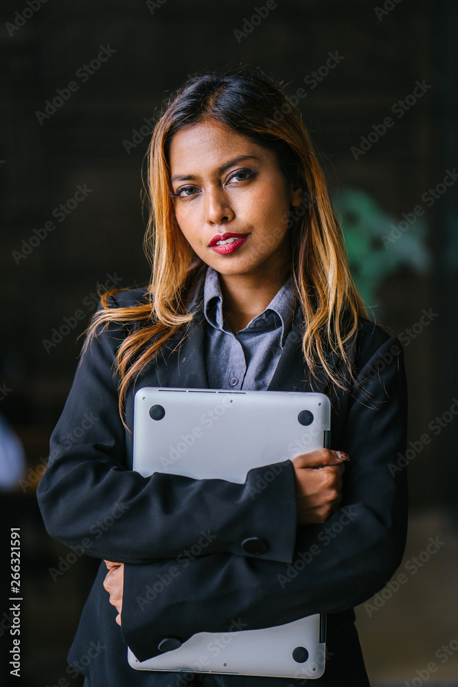 Closeup portrait of a Southeast Asian woman, professional or ...
