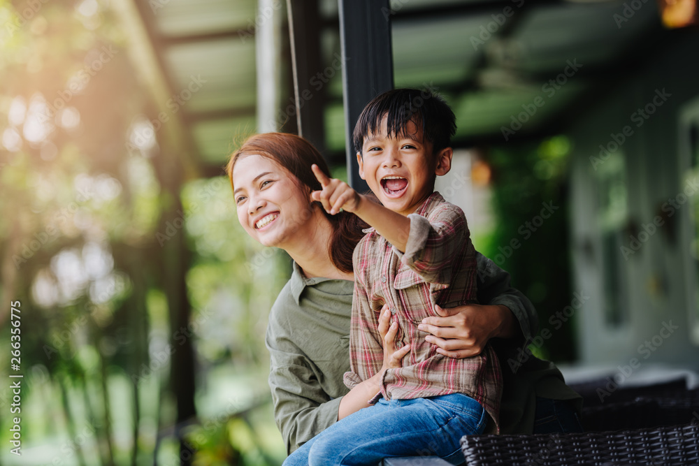 happy harmonious family outdoors concept.mother and son have activities ...