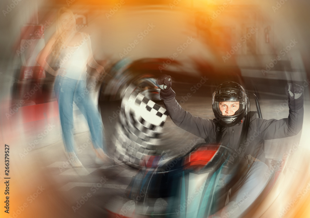 Man finishing race on racing car at kart circuit Stock Photo | Adobe Stock