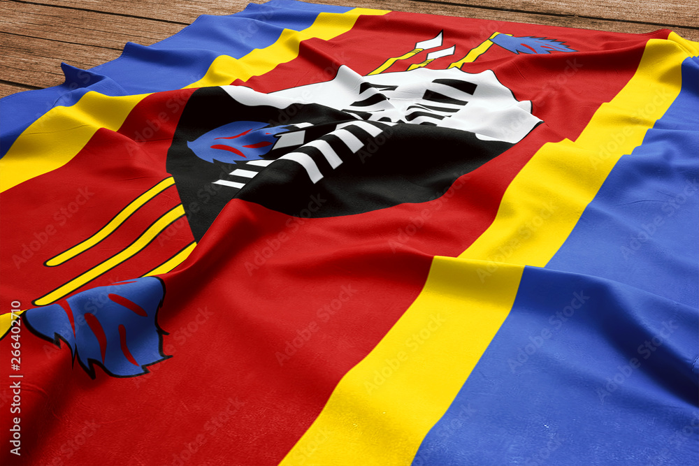 Flag of Swaziland on a wooden desk background. Silk Swazi flag top view ...