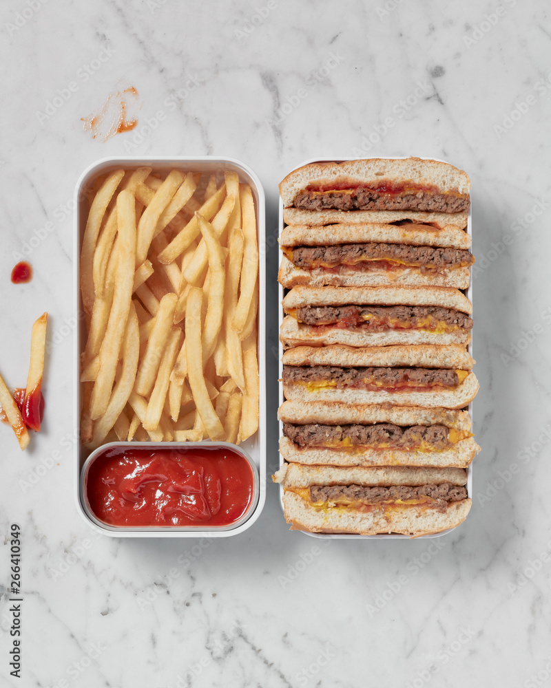 Unhealthy Bento box with junk food on white marble Stock Photo | Adobe ...