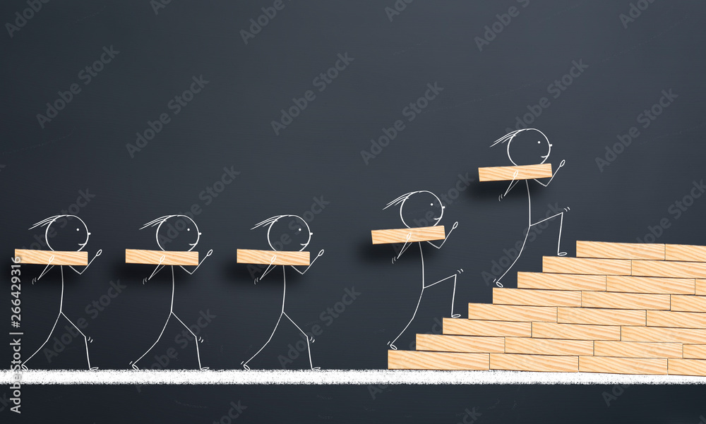 teamwork concept.Team members carry the blocks on their shoulders and ...