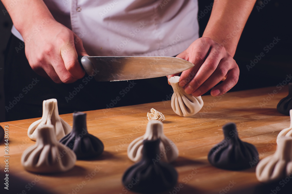 National Georgian cuisine Khinkali metal background Cook prepares ...