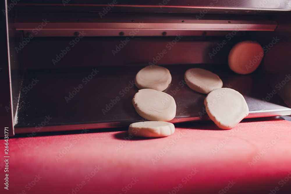 Chef making dough pastry sheeter bakery Baker forming shaping dough ...