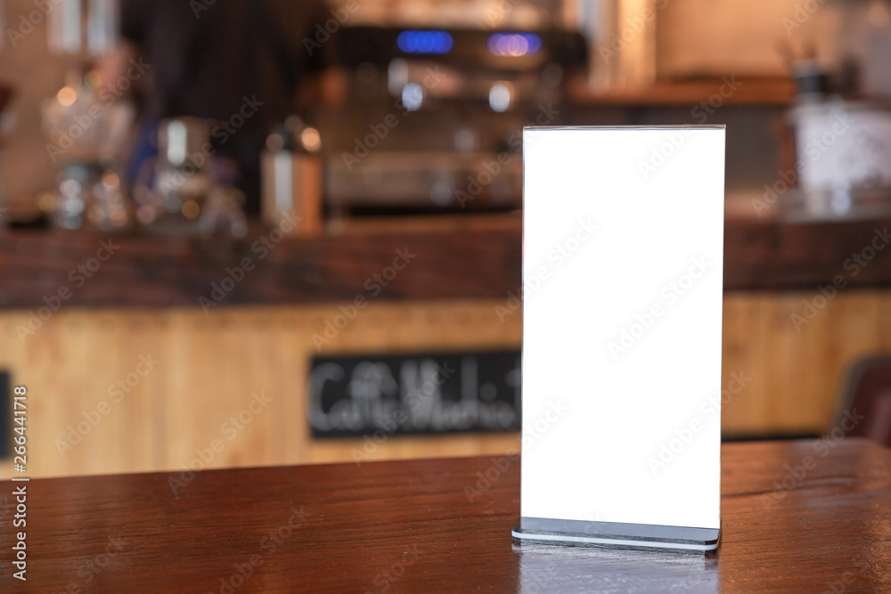 Mock up Menu frame standing on wood table in coffee shop. space for ...