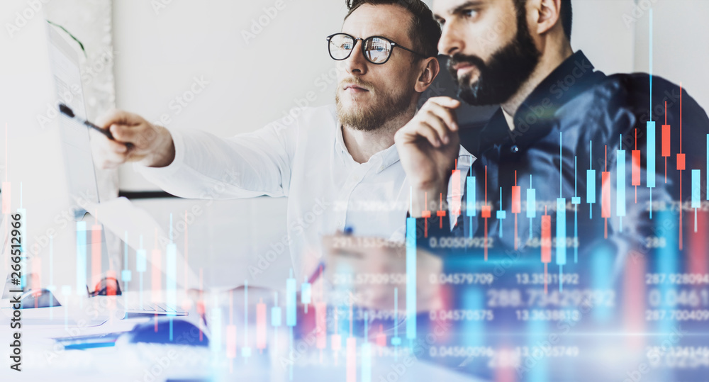 Two professional traides looking on technical price graph and indicator ...