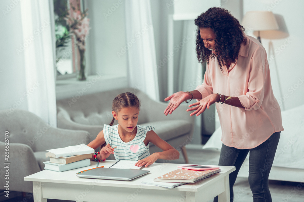 Angry mother losing her temper and yelling at small daughter Stock ...