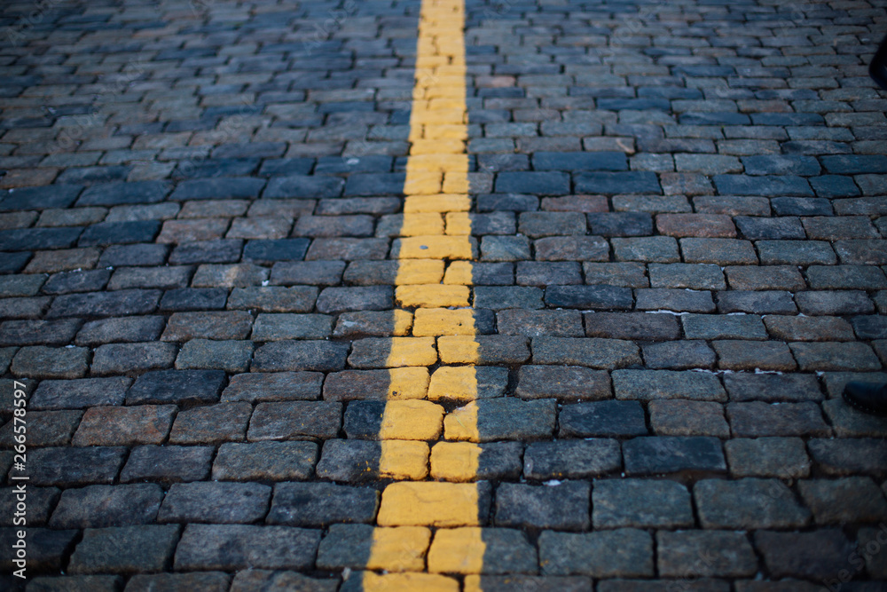 Stone pavement in perspective. Old street paved with stone blocks with ...