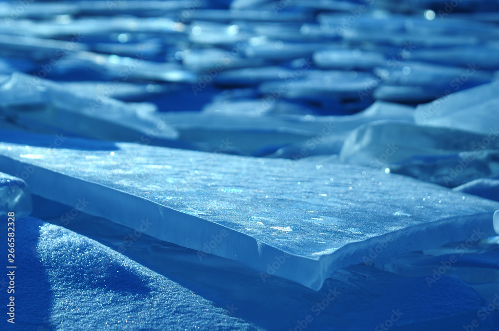 Sun rays are refracted by the transparent ice of Lake Baikal. crystal ...