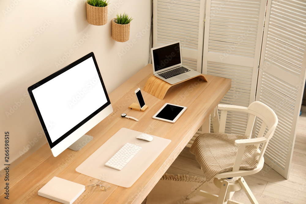 Stylish workplace interior with modern computer on table. Mockup for ...