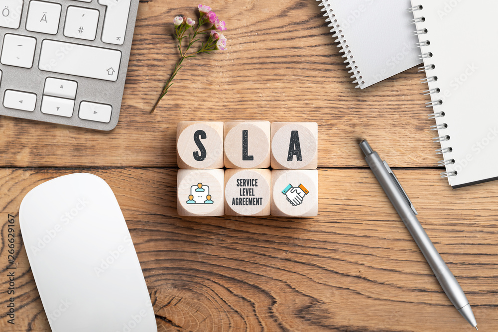 cubes with acronym SLA for "service level agreement" wooden background ...
