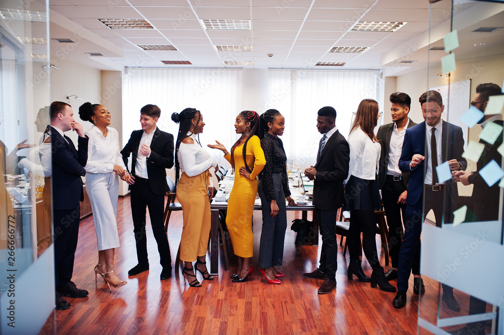Large group of eleven multiracial business people standing at office ...