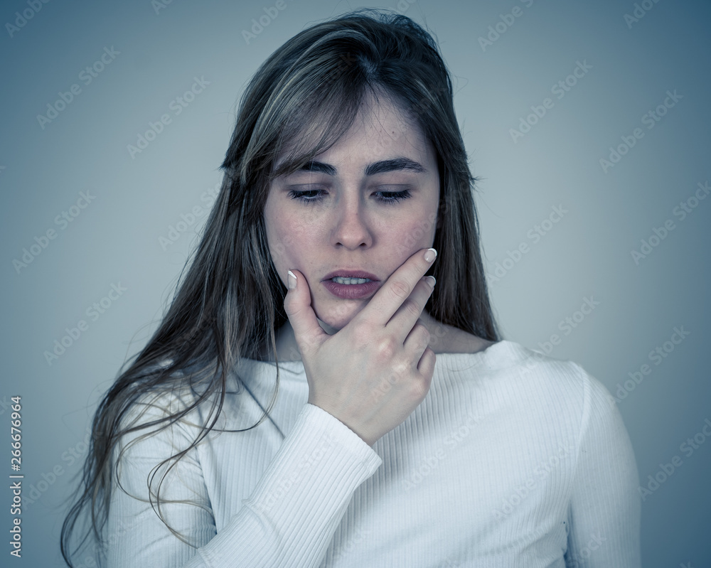 Portrait of sad and intimidated woman. Isolated in white background ...