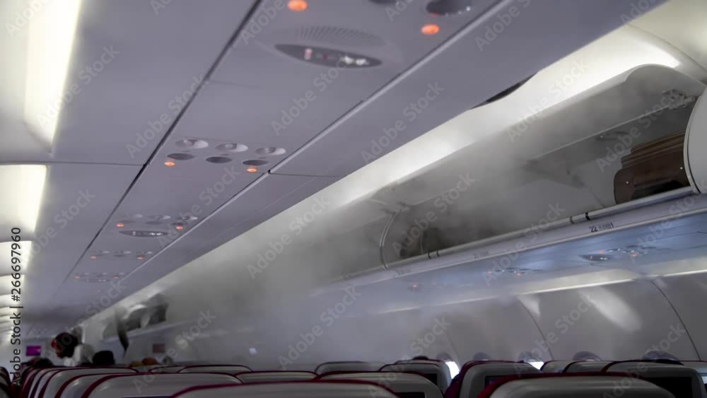 Disinfectant spray in the aircraft interior. Cabin disinfection with ...