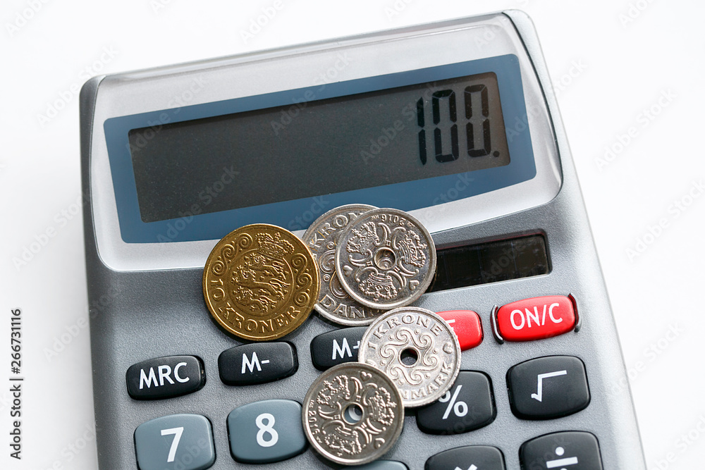 Mixed Danish Coins On A Calculator Accounting Concept The Krone Is mixed-danish-coins-on-a-calculator-accounting-concept-the-krone-is