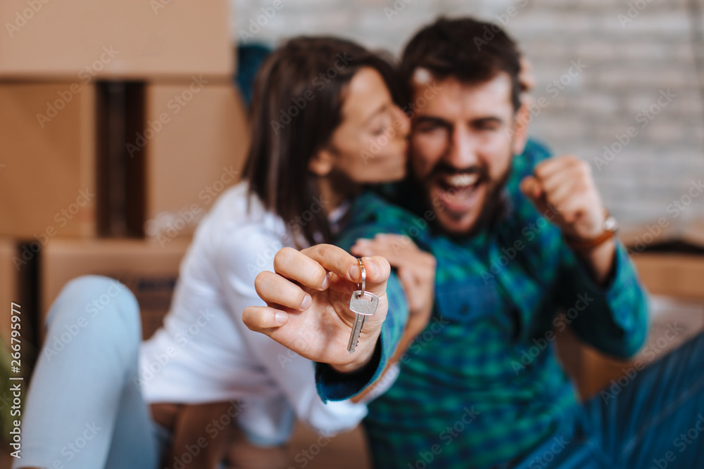 Young happy couple showing the keys of a new home Stock Photo | Adobe Stock