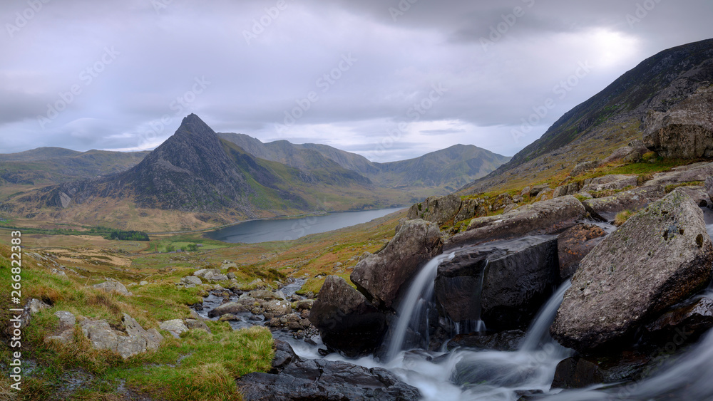 Tryfan in spring with the Afon Lloer in flow over the waterfalls, Wales ...
