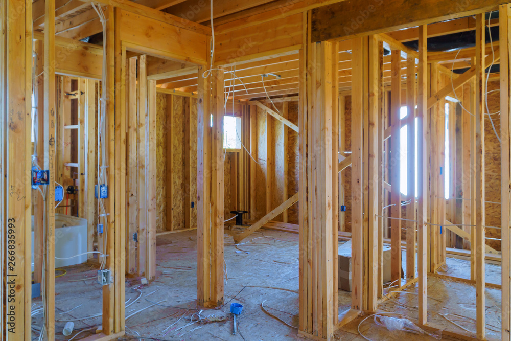 Timber frame house, stick built home under construction with wooden ...