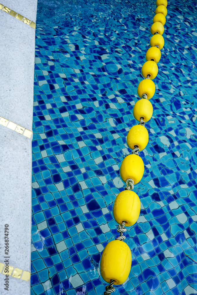 Blue pool water and yellow swimming lane marker in swimming pool Stock ...