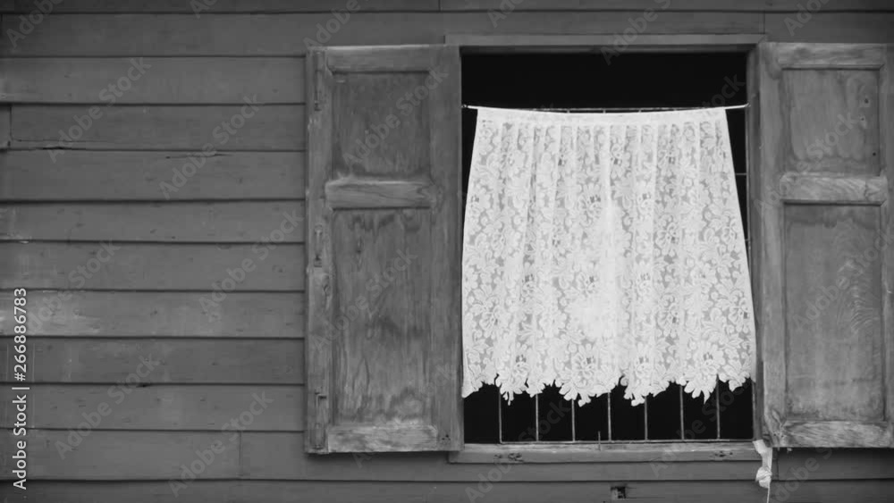 Vidéo Stock 4K. open window with white curtain moving by the wind ...