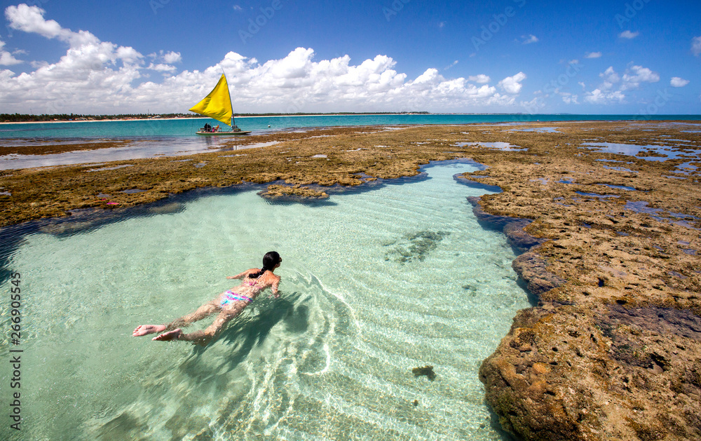 Woman swimming and relaxing on natural pool in Porto de Galinhas ...