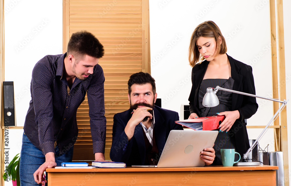 Teamwork in action. Business team working and communicating together at ...