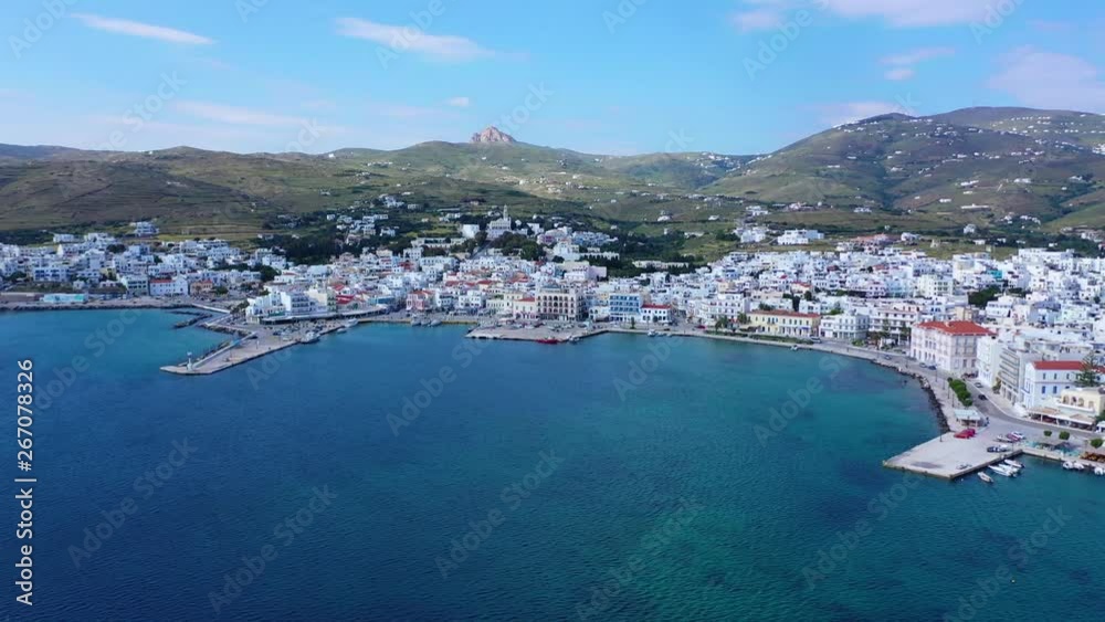 Aerial drone video of iconic main town and port of Tinos island ...