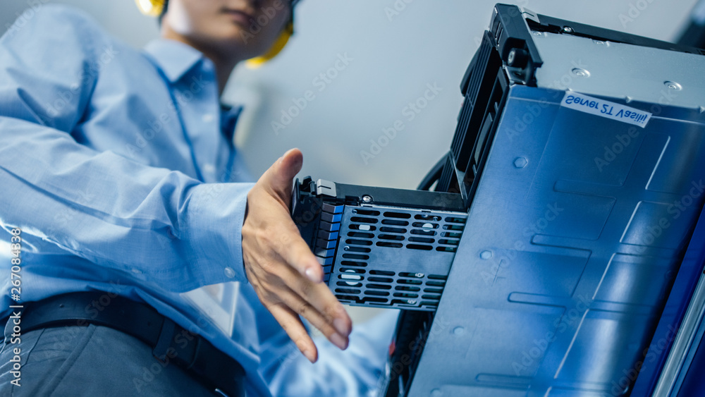 In the Data Center: IT Engineer Installs New HDD Hard Drive and Other ...