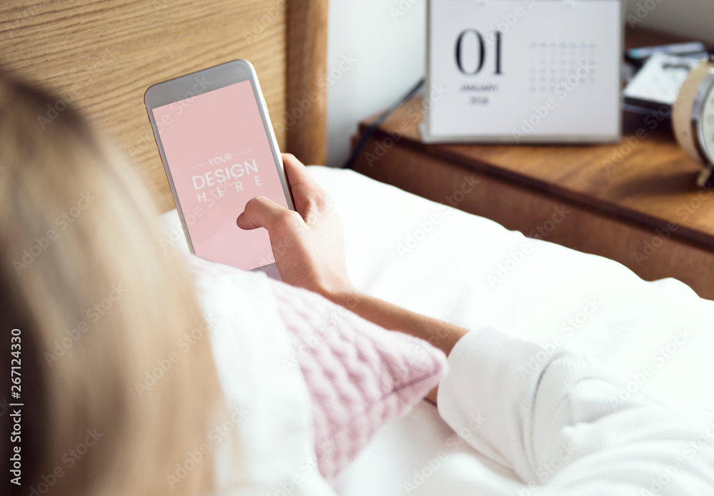 Person Using Smartphone on a Bed Mockup Stock Template | Adobe Stock