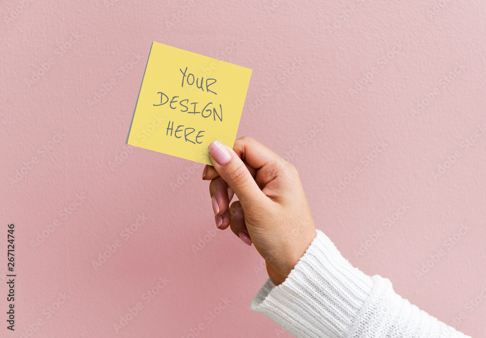Hand Holding Sticky Note Mockup on a Wall Stock Template | Adobe Stock