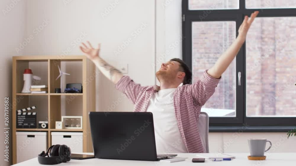 technology, internet and people concept - happy young man with laptop ...