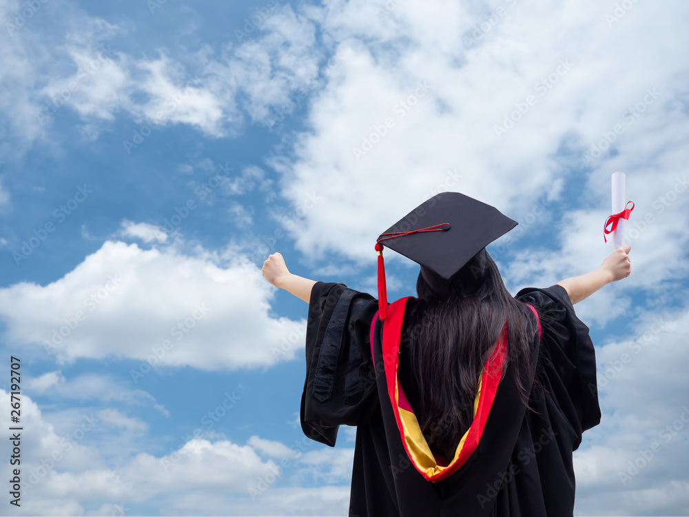 Portrait backside of happy girl on graduation day. Student wear ...