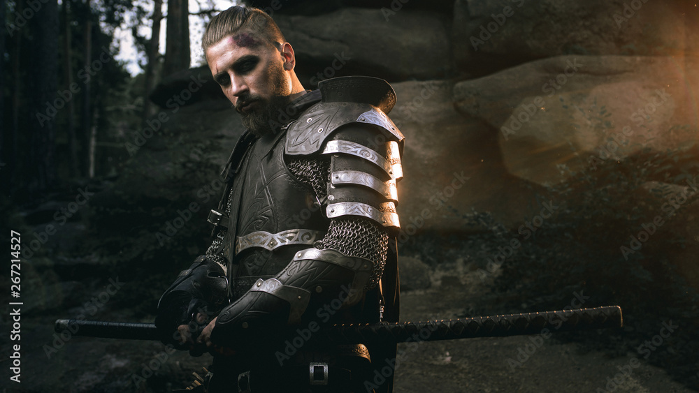 mystery scarface knight in armor with sword and crossbow in the forest ...