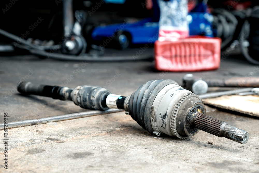 Change the new drive shaft in the car. Stock Photo | Adobe Stock