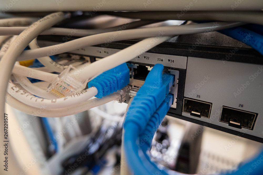 Close-up of Ethernet cable pluged on network switch, UTP cabling and computer network Stock ...