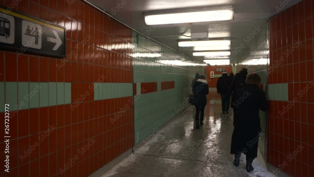 Wideo Stock: A snow laden subway pedestrian tunnel with peoplePeople ...