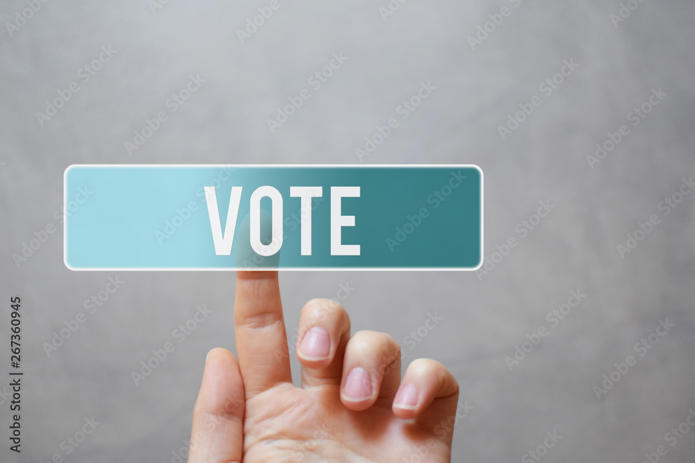 Vote - hand pressing blue translucent button on virtual touchscreen ...