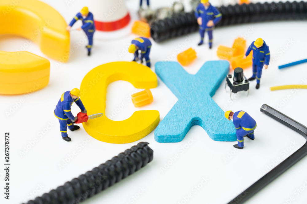CX, Customer Experience concept, miniature figure worker building ...