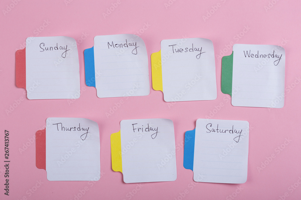 The days of the week - the paper stickers attached to the pink ...