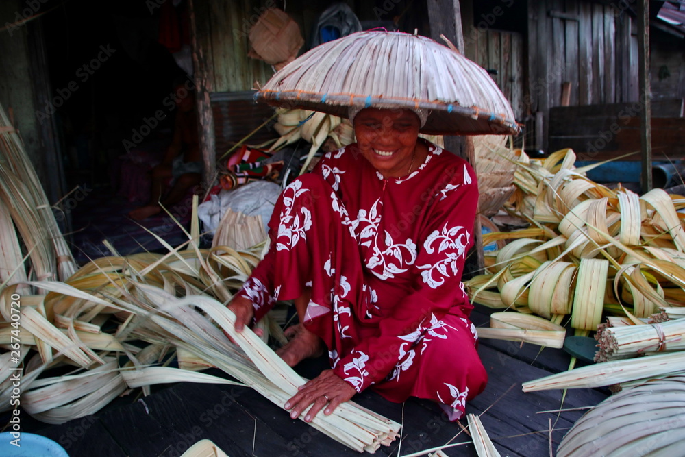 craftswomen when making Caping called Tanggui traditional Banjar hat ...