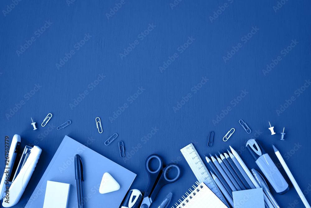 School supplies on blue background. Top view. Copy space. Trendy color ...