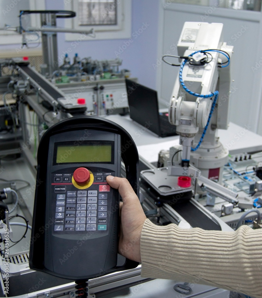 Industry 4.0 concept. Man is holding tablet to control smart factory ...