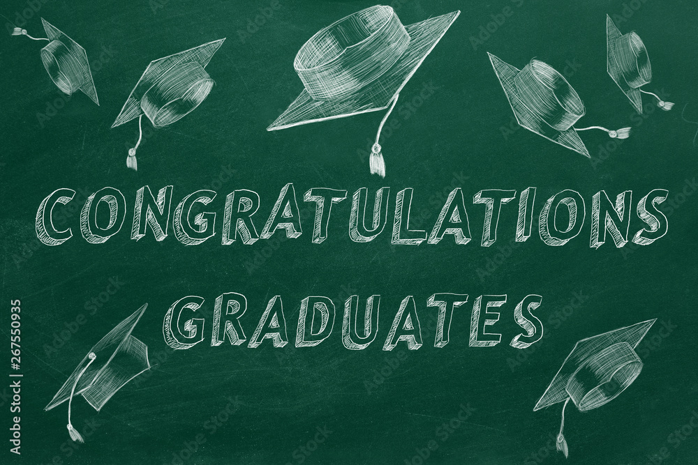 Hand drawing text "Congratulations graduates" and graduation caps on ...