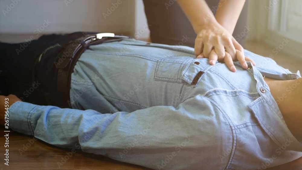 4K. volunteer office woman use hand pump on chest for first aid ...