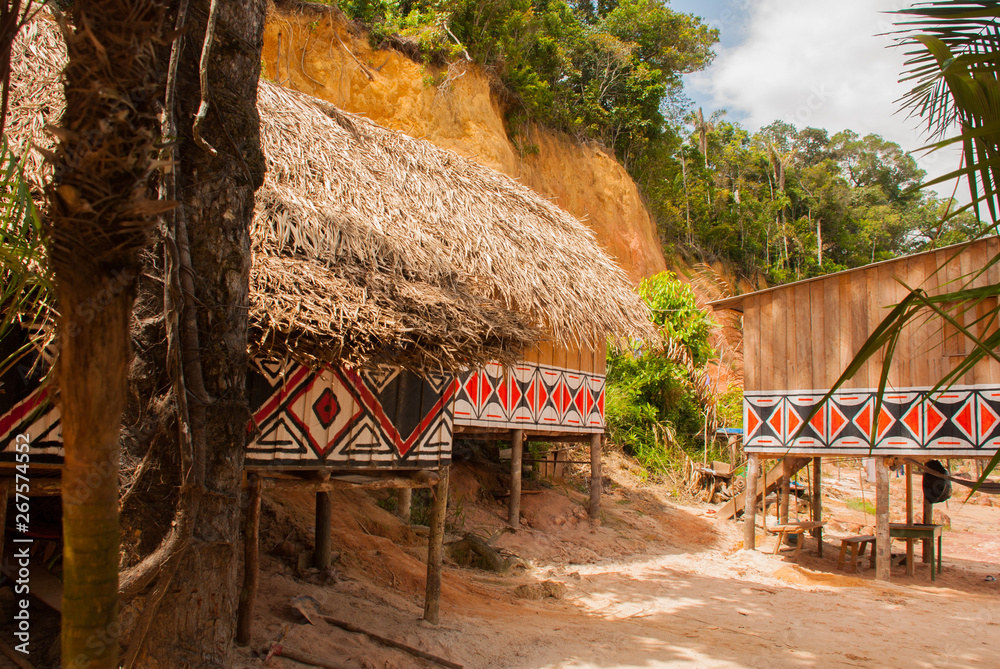 Poster Large house covered with sape grass, Indigenous tribe village ...