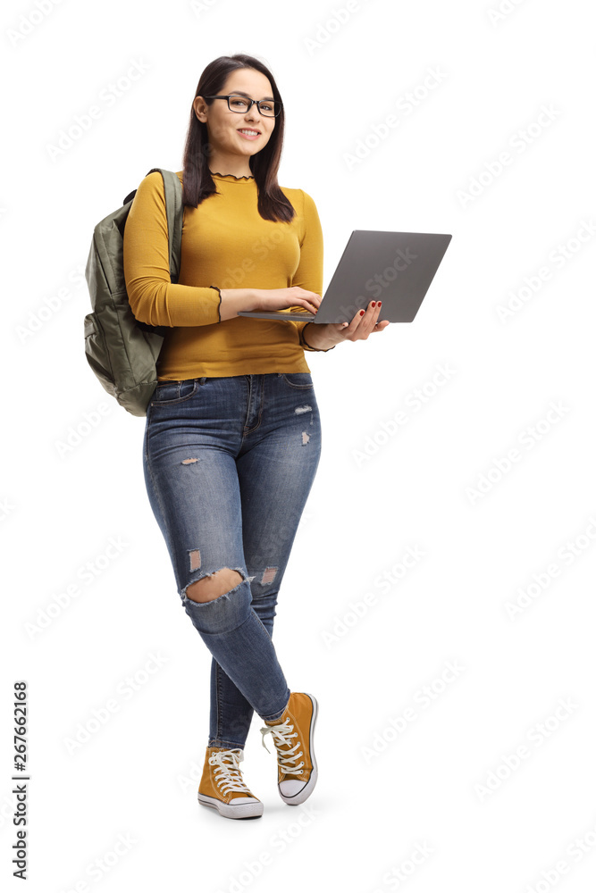Female student standing and posing with a laptop computer Stock Photo ...