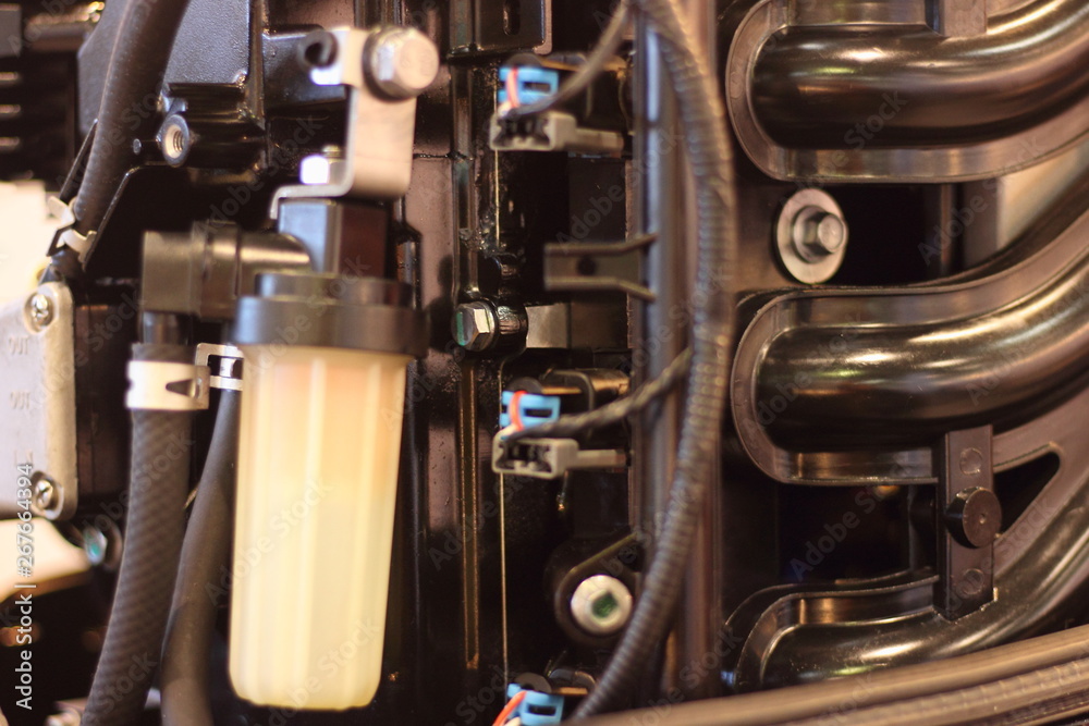 Fuel system of boat outboard motor close up, gasoline filter, injector ...