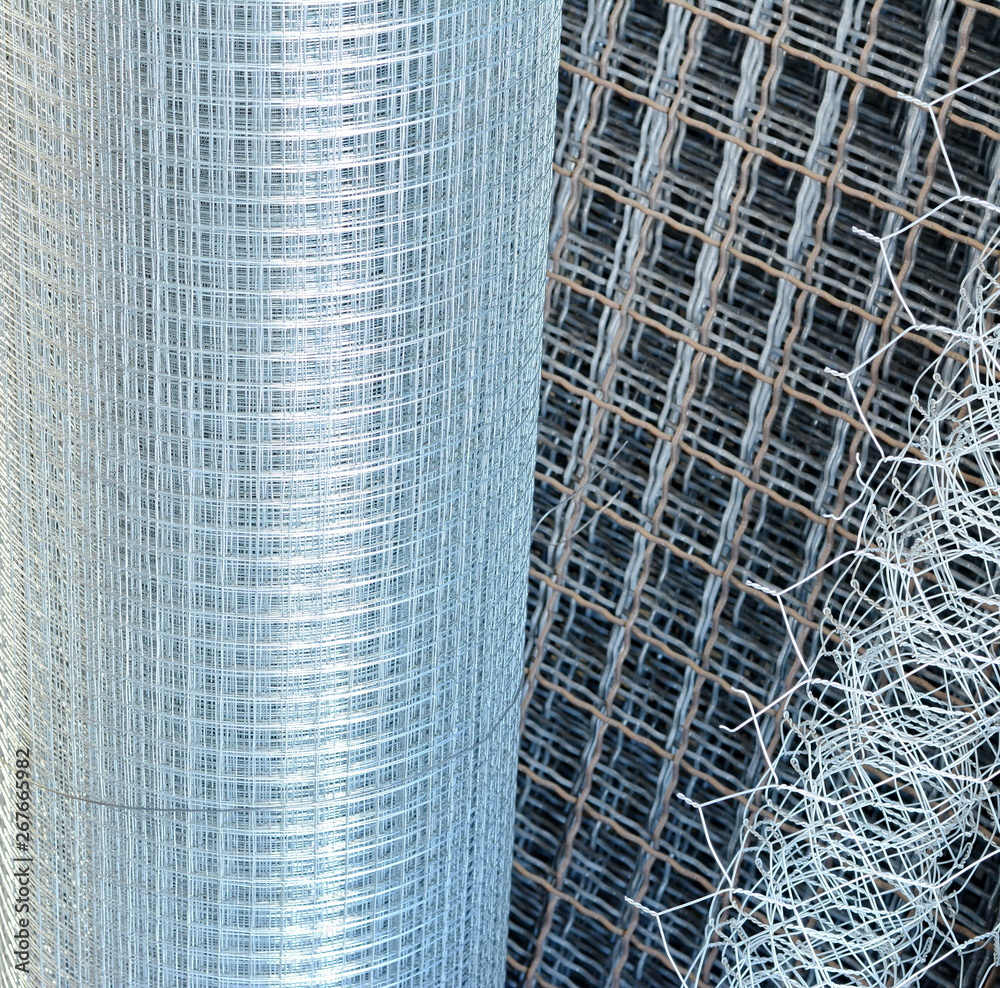 roll of metallic net. Rolls of metal wire fence different heights ...