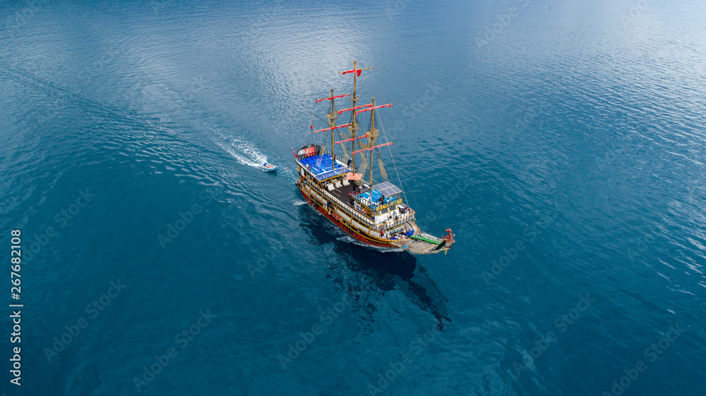 Aerial view of sea and yacht. Sailing ship in the middle of ocean, top ...